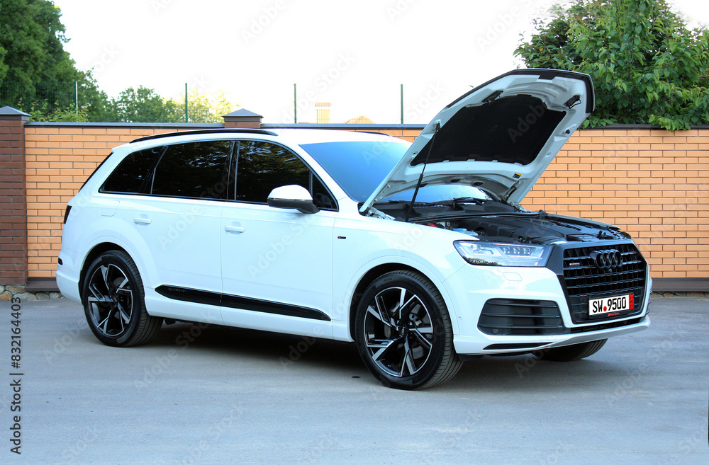 Vinnytsia, Ukraine; May 23, 2024. White Audi Q7 S-Line open hood ...