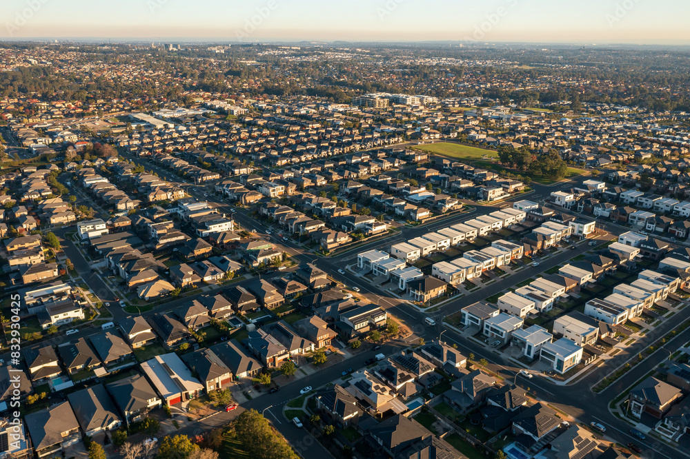 Wide aerial view of streets with similar sized modern Australian homes ...