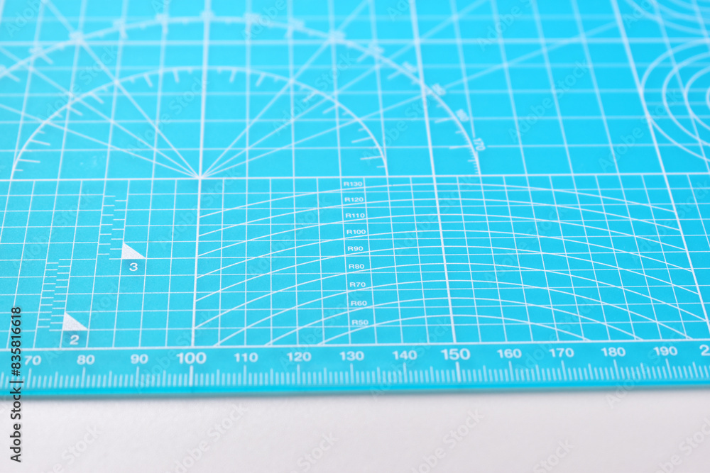 blue cutting mat board on white background with line and scale measure ...