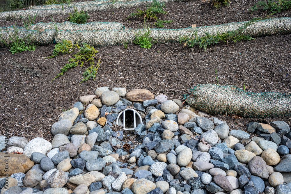 New installation of storm water flood management, round outflow pipe ...