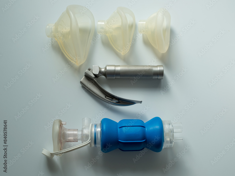 On the table there are face masks for the anesthesia machine, a ...