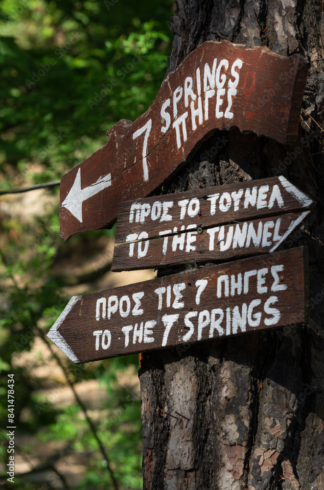 Signs with arrows in different directions and inscriptions with the ...