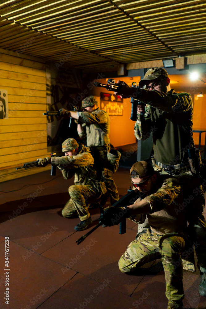 at a professional shooting range military trainers perform tactical ...
