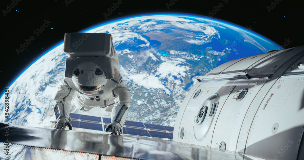 Space Engineer Servicing a Panel on a Communication Satellite, Checking ...