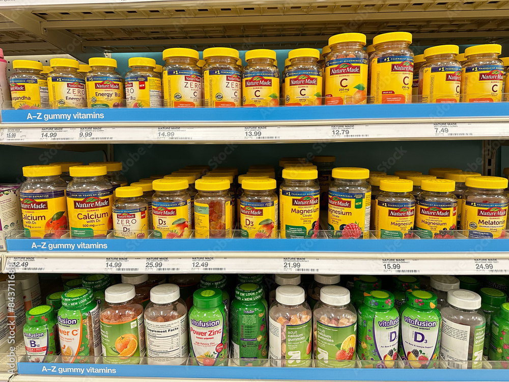 Variety of dietary and vitamin supplement products on the store shelf ...