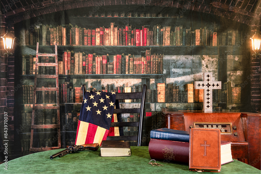 Bibles and handgun on green table with American flag draped over chair ...