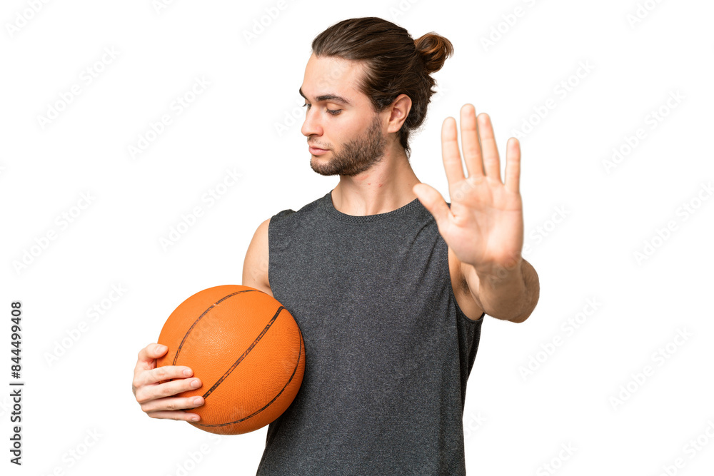 Young basketball player man over isolated background making stop ...