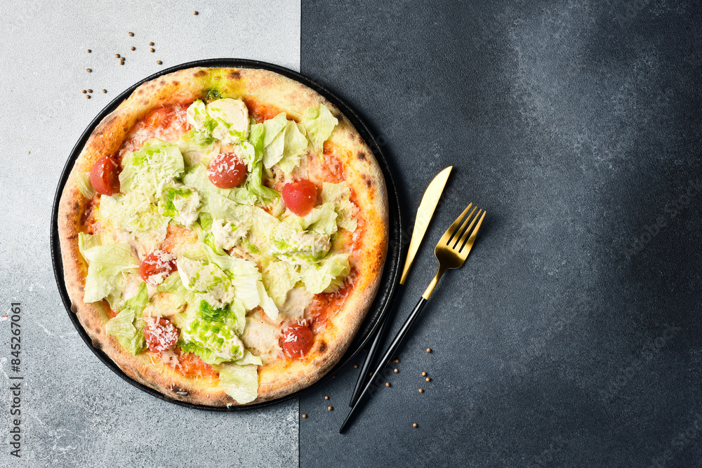 Traditional Caesar pizza. Pizza with lettuce, cherry tomatoes and sauce ...