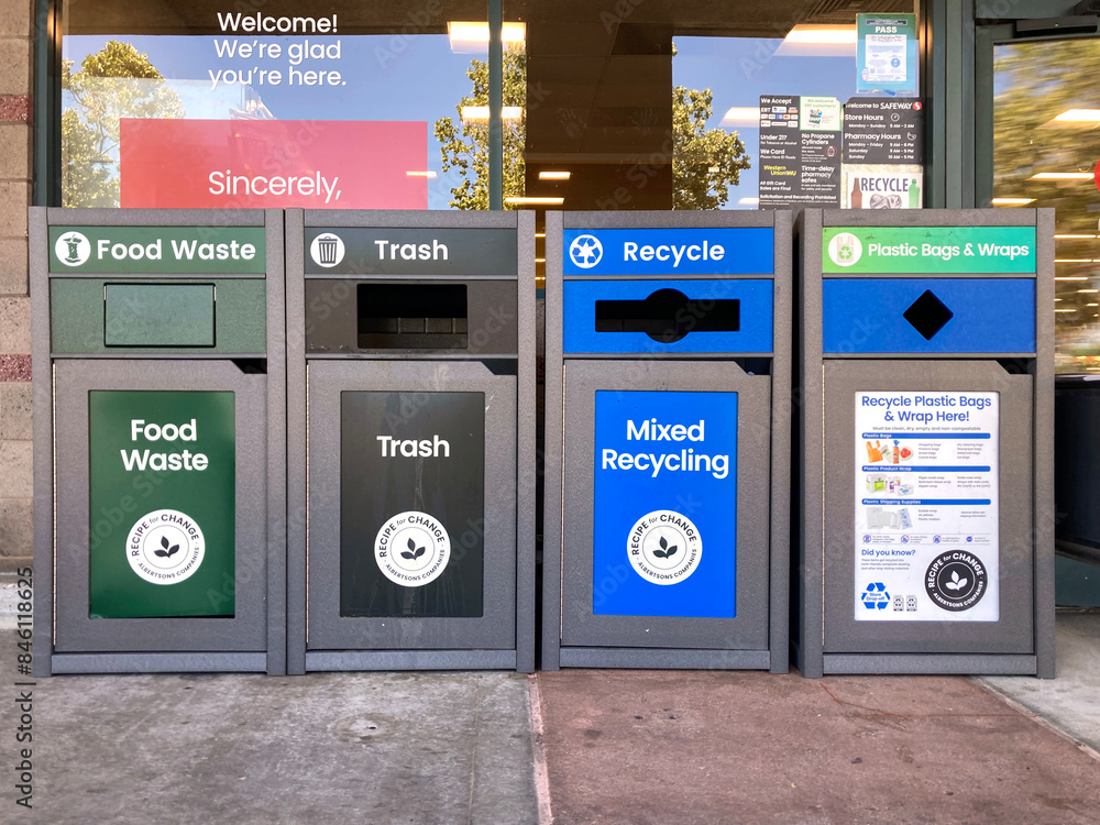 Four labeled bins for different types of waste: Food Waste, Trash ...