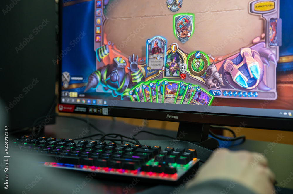 Focus on Hands, Keyboards and Mouse. Back view of young gamer playing ...