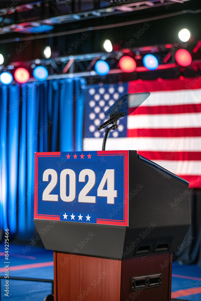 election podium with 2024 sign in front of an American flag and stage ...