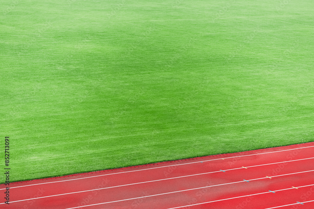sport arena soccer field green grass surface and red running track road ...