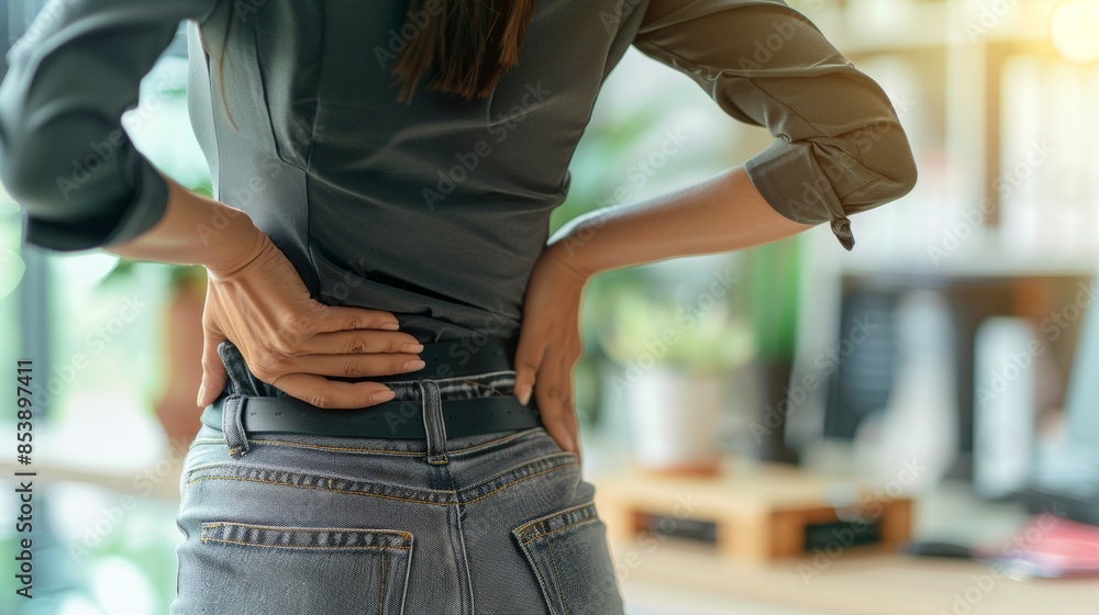 Asia beautiful woman holding her lower back while and suffer from ...