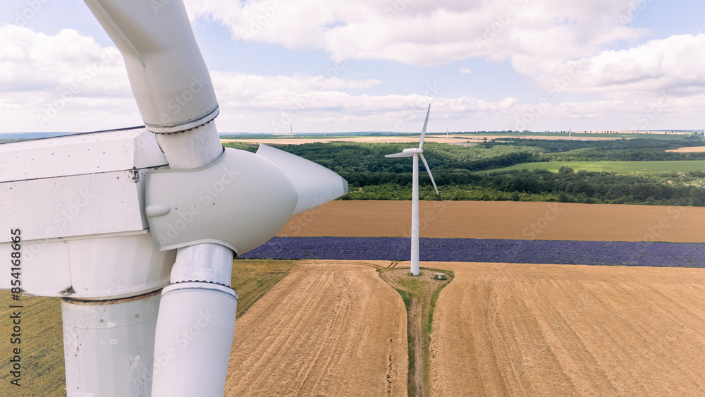 Aerial drone shot Wind Turbine blade producing alternative gren energy ...