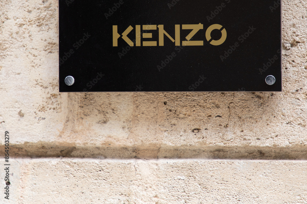 Kenzo sign text and logo brand wall facade chain entrance luxury ...