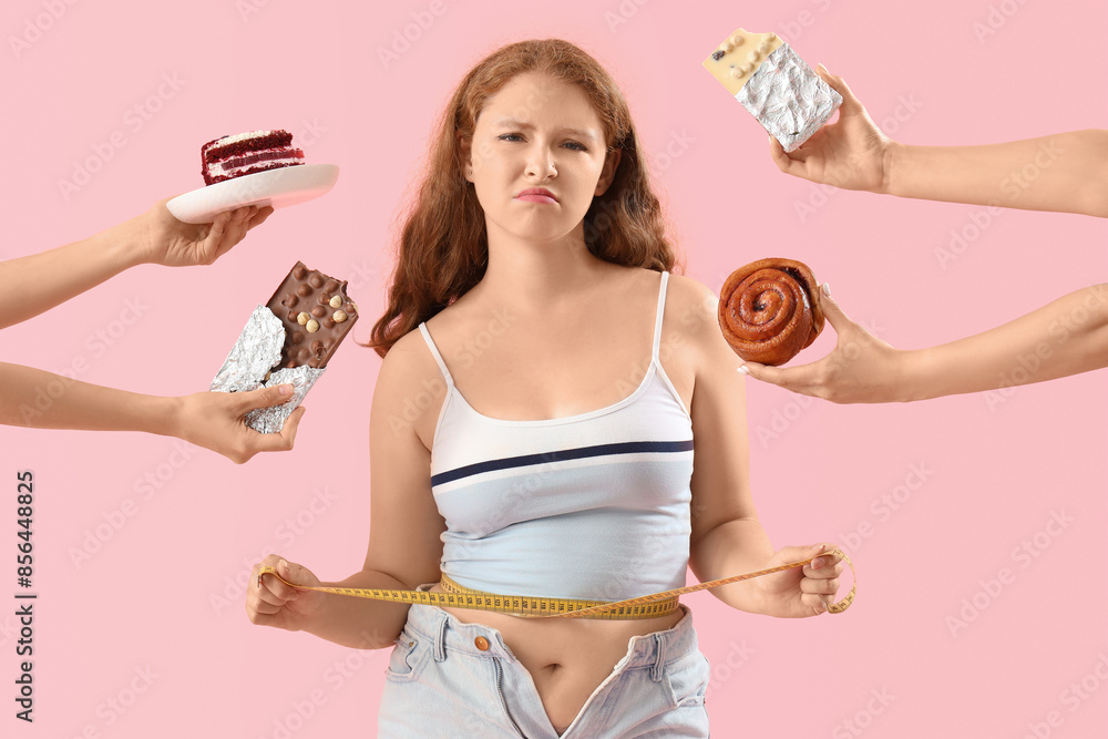 Young woman in tight shorts measuring her waist and hands with ...