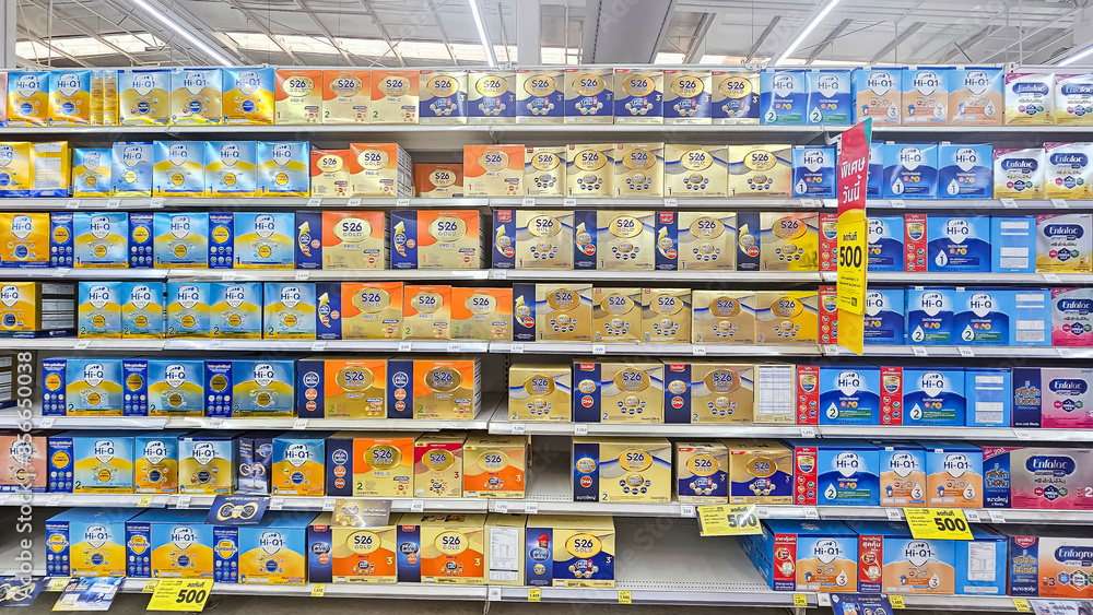 Window display of baby formula milk product on shelves in convenience ...