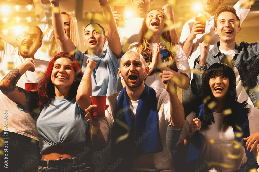 Crowd of sport fans cheering during match on stadium. Excited people ...