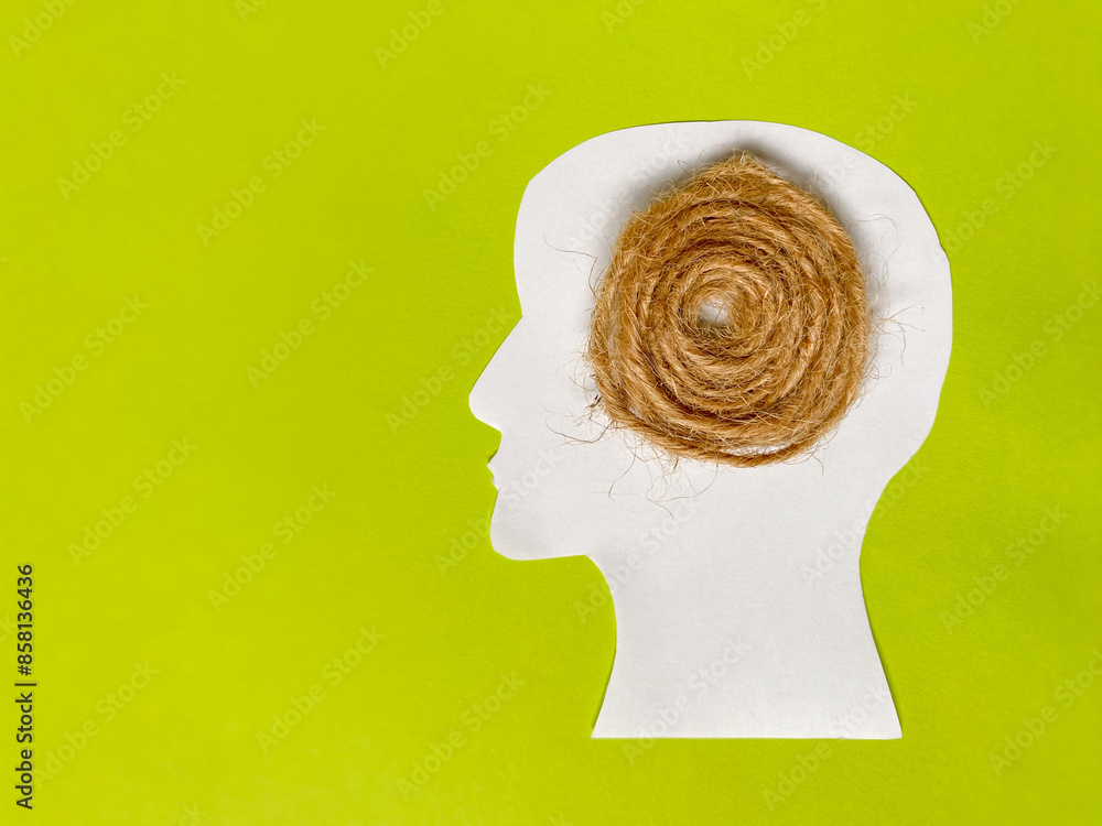 Man's head with untangled thread in spiral shape with copy space ...