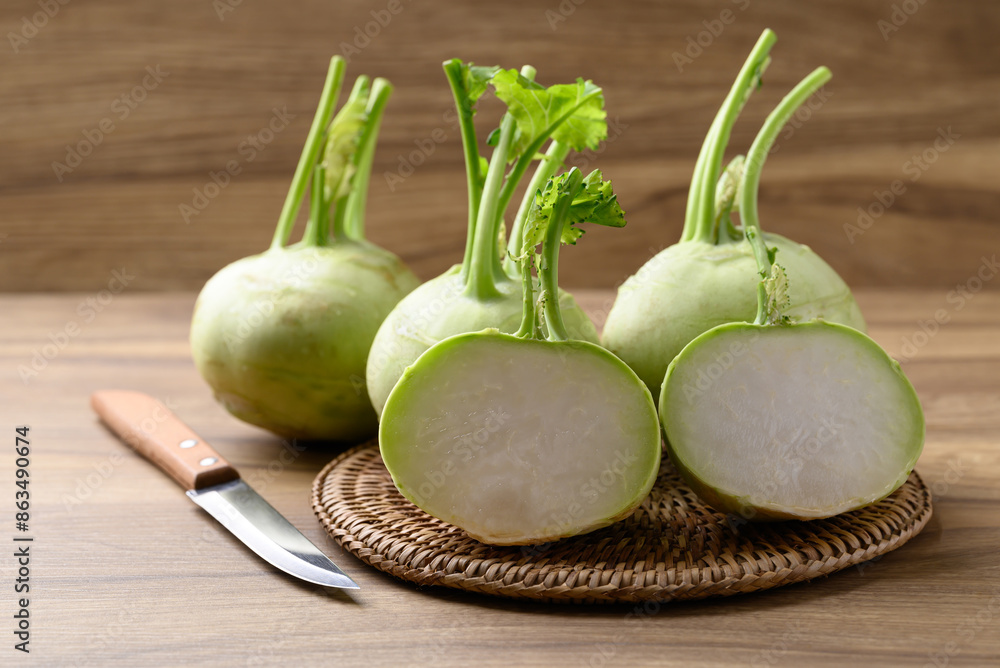 Kohlrabi or turnip cabbage on wooden background, Edible vegetable both ...