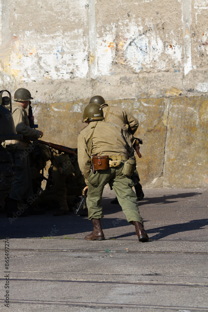 Historical reconstruction. American infantry soldiers of WWII fight in ...