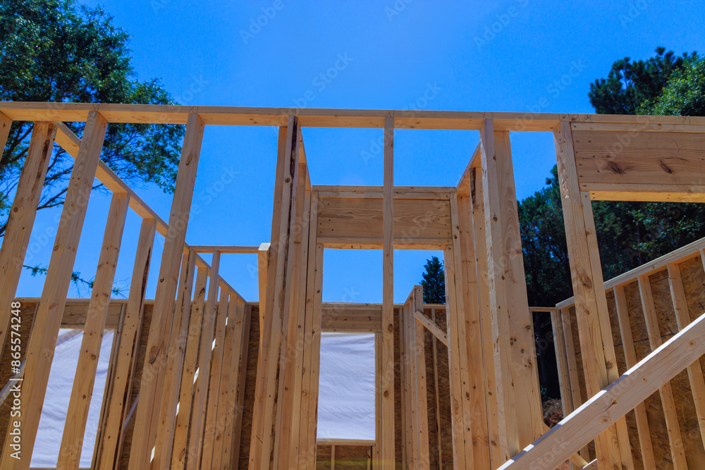 During construction of new house, an internal support beam is framed ...