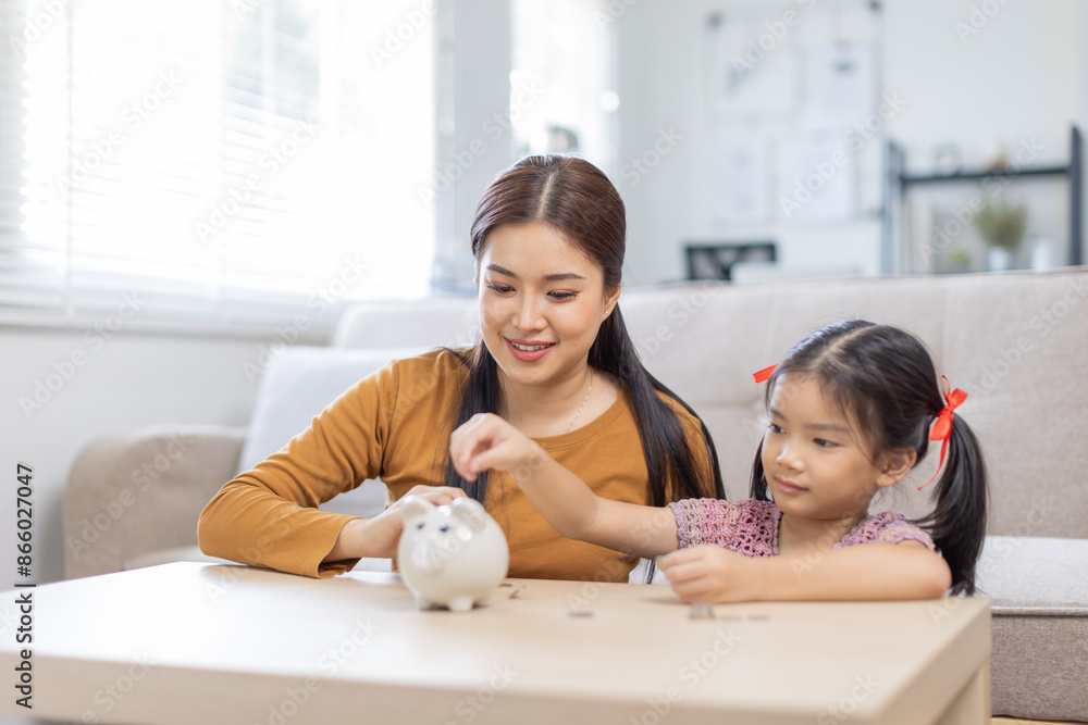 Setting good example. Young parent mother teach child little daughter ...