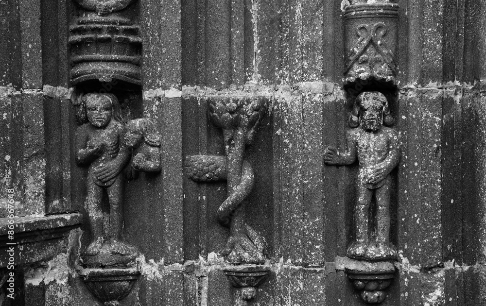 Adam, Eve and Forbidden fruit story bas relief on exterior of church in ...