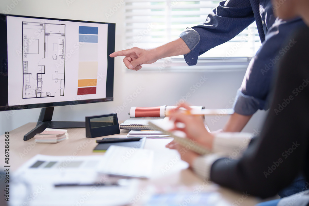 Interior designer women and senior businessman checking blueprint of ...