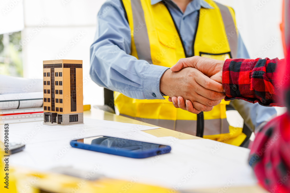Two men, including a male Asian construction contractor engineer ...