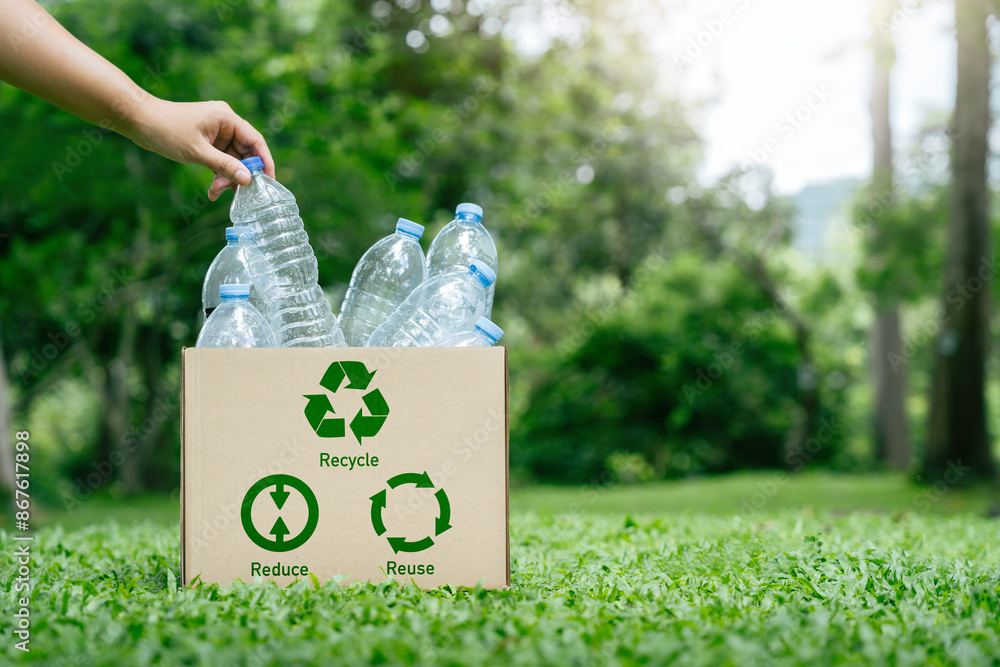 Recycle reduce reuse in zero waste concept. Hand holding plastic bottle ...