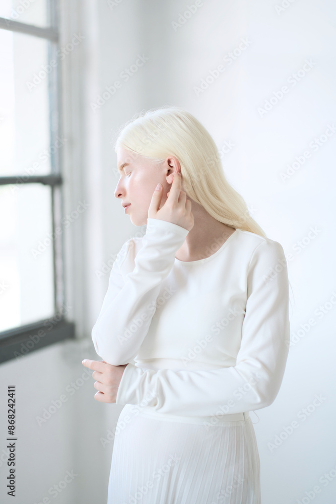 Pretty albino teen girl, beautiful unique woman model in white touching ...