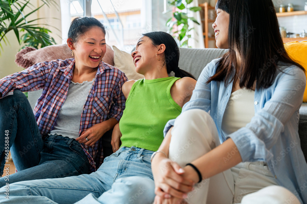 Happy beautiful chinese women friends bonding at home Stock Photo ...