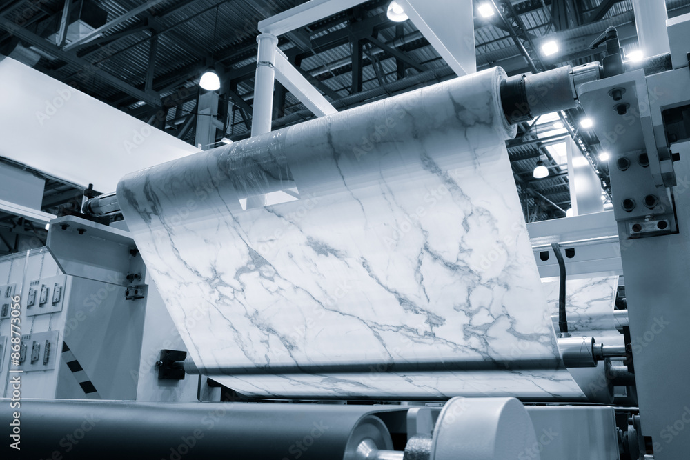 At the factory, a roll of polyethylene plastic film with a marble ...