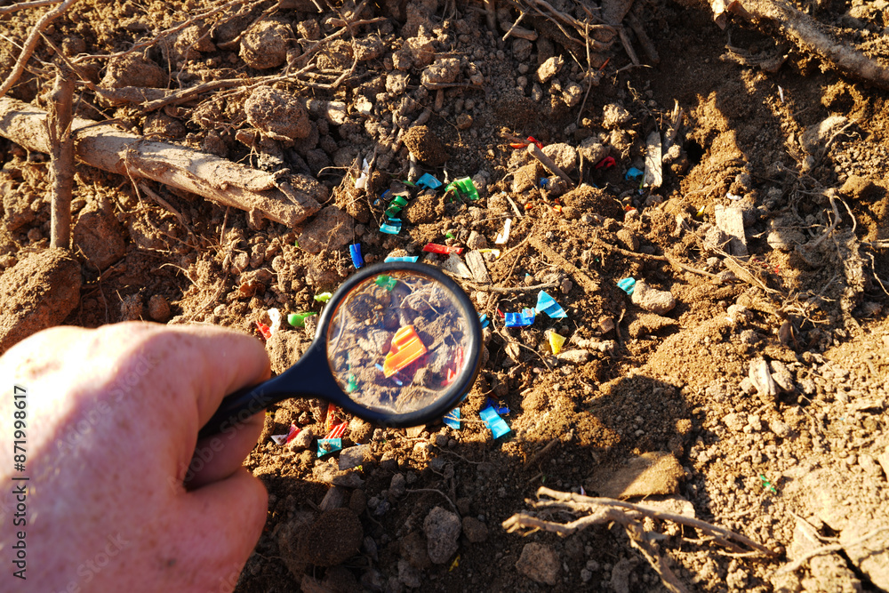 Photo Stock Microplastic pollution. Microplastics in ground. Soil ...
