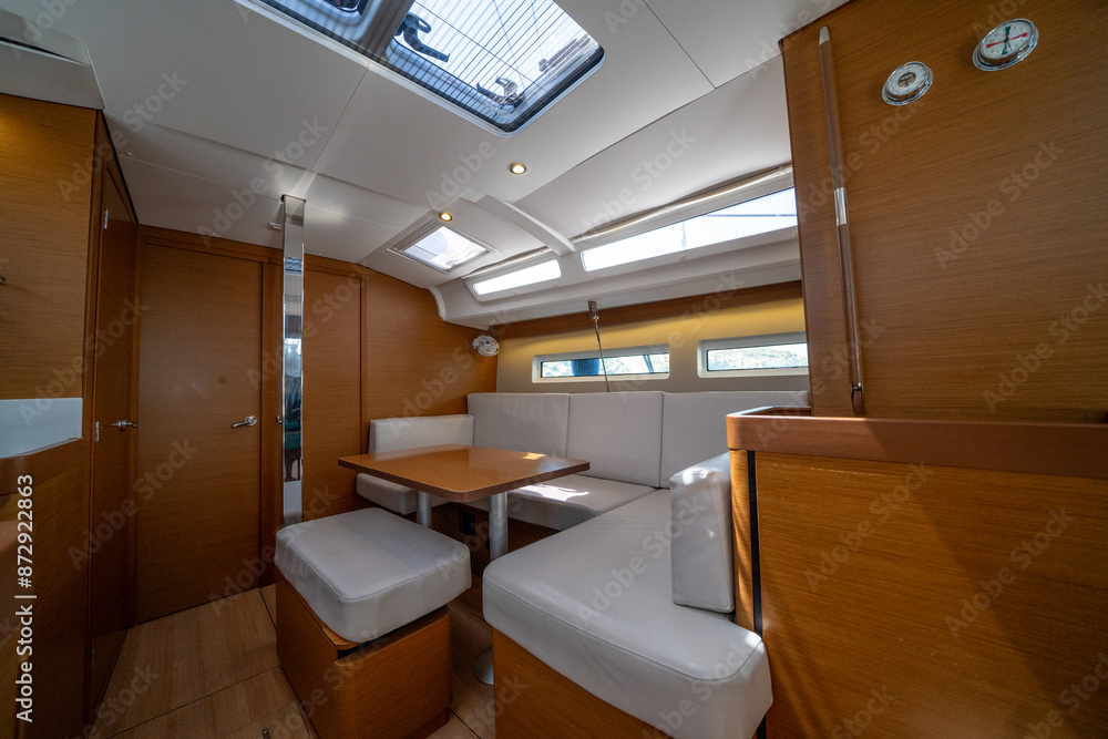 Sailing yacht interior. Double cabin on a charter yacht. Bareboat yacht ...