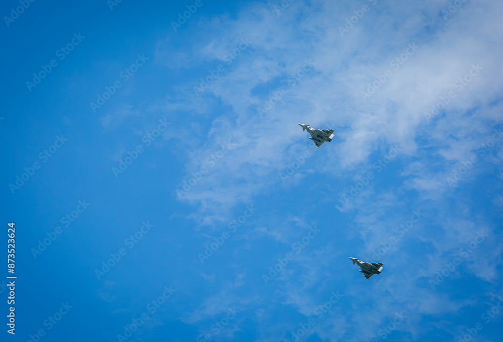 Two RAF typhoons flying, flying in formation back to their respected ...