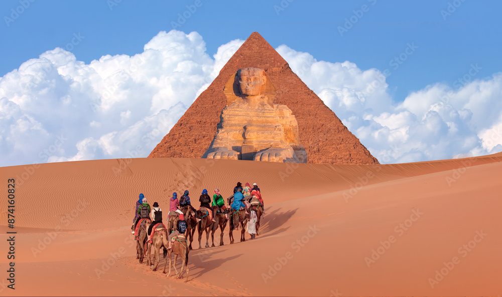 Group of tourists riding camels seeing the pyramids of Menkaure ...