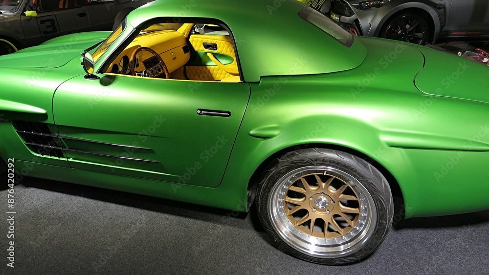 Side view of tuned metallic green tuning modification of vintage german ...