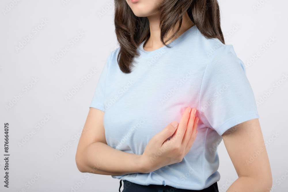 Breast cancer checking. Woman checking her breast on white background ...