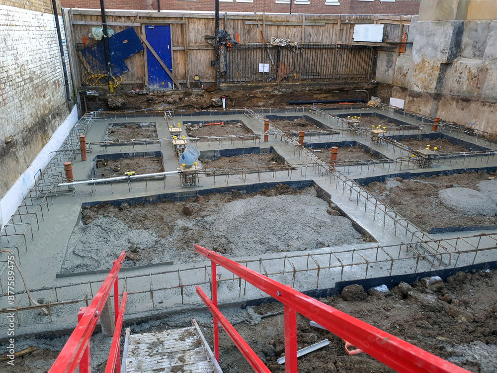 Foundation slab with rebar and plumbing installed, ready for ground ...