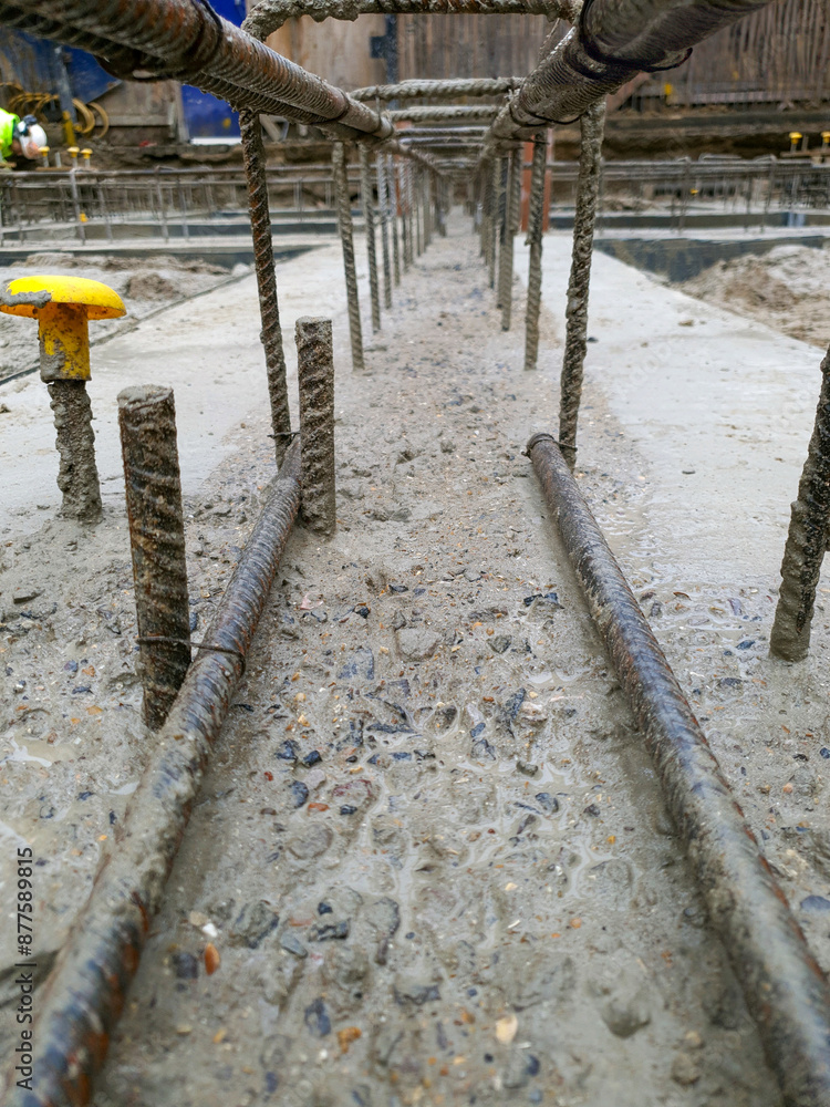 Construction site with rebar placement for foundation footing, steel ...