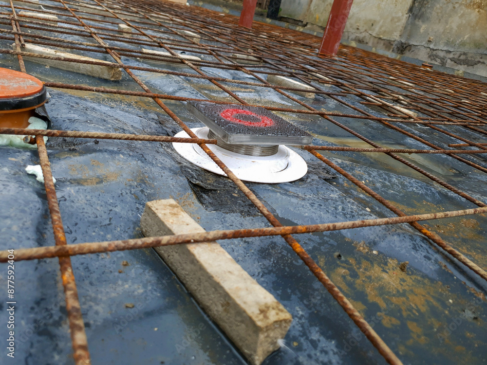 Stock-Foto „Steel mesh on polythene and concrete bar spacer with gully ...