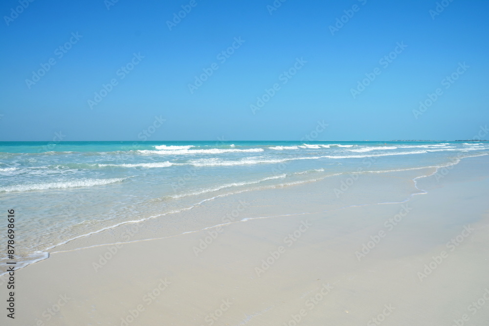 Beautiful soft waves of Blue Ocean with Sandy Beach Background close up ...