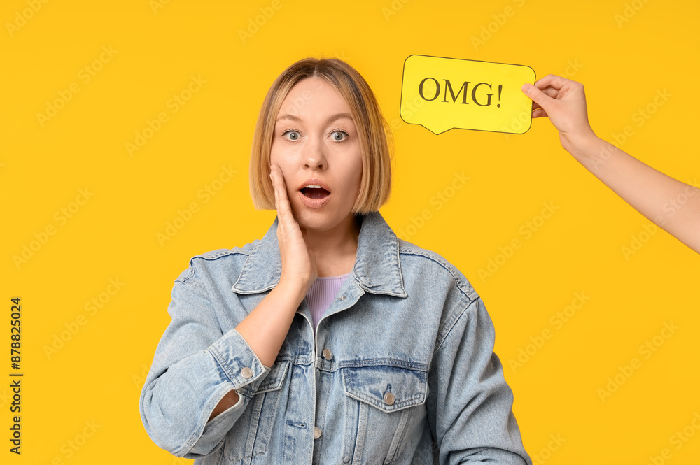 Shocked adult woman and female hand holding speech bubble with word OMG ...