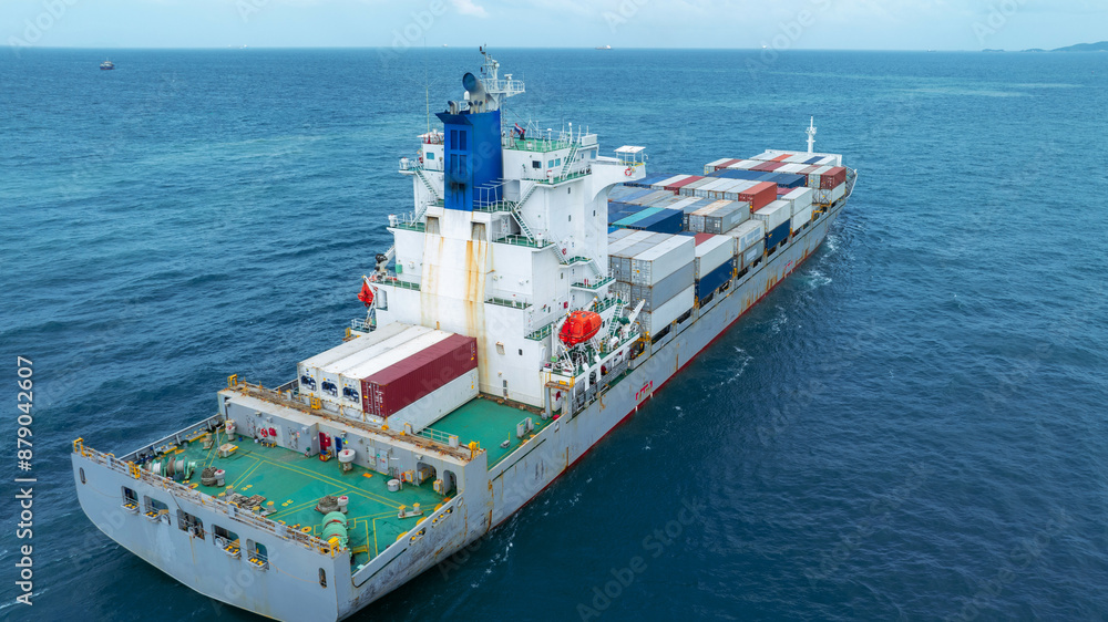 Stern of Cargo container ship carrying container and running in the ...