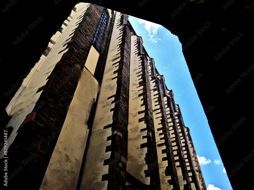 stone blocks emerge from the lime plaster. cathedrals. architraves of ...