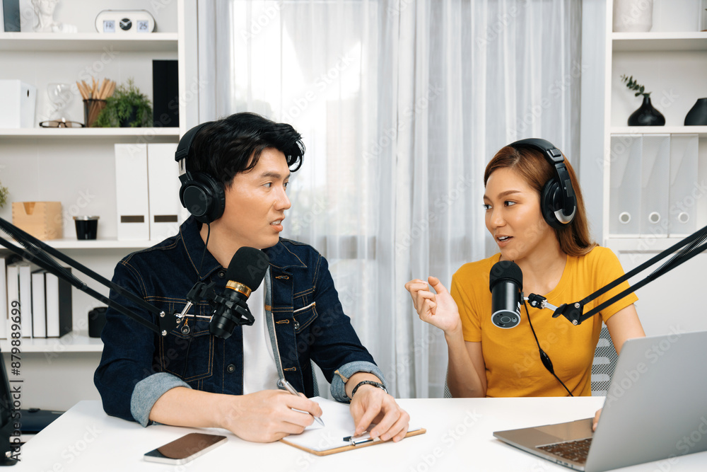 Smiling radio influencer hosts wearing headphones with channel social ...