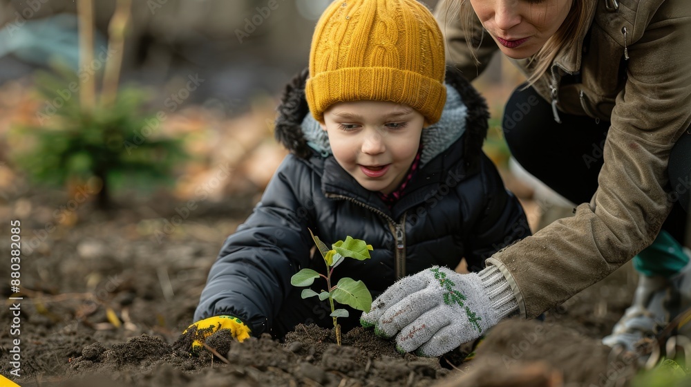 Mother and Child Planting a Young Tree Together in an Autumn Garden ...