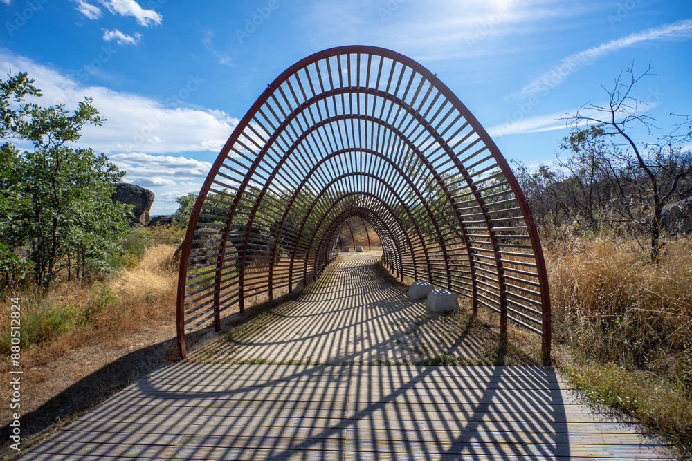 Tunnel in wooden slats for people to pass through in the interior of ...